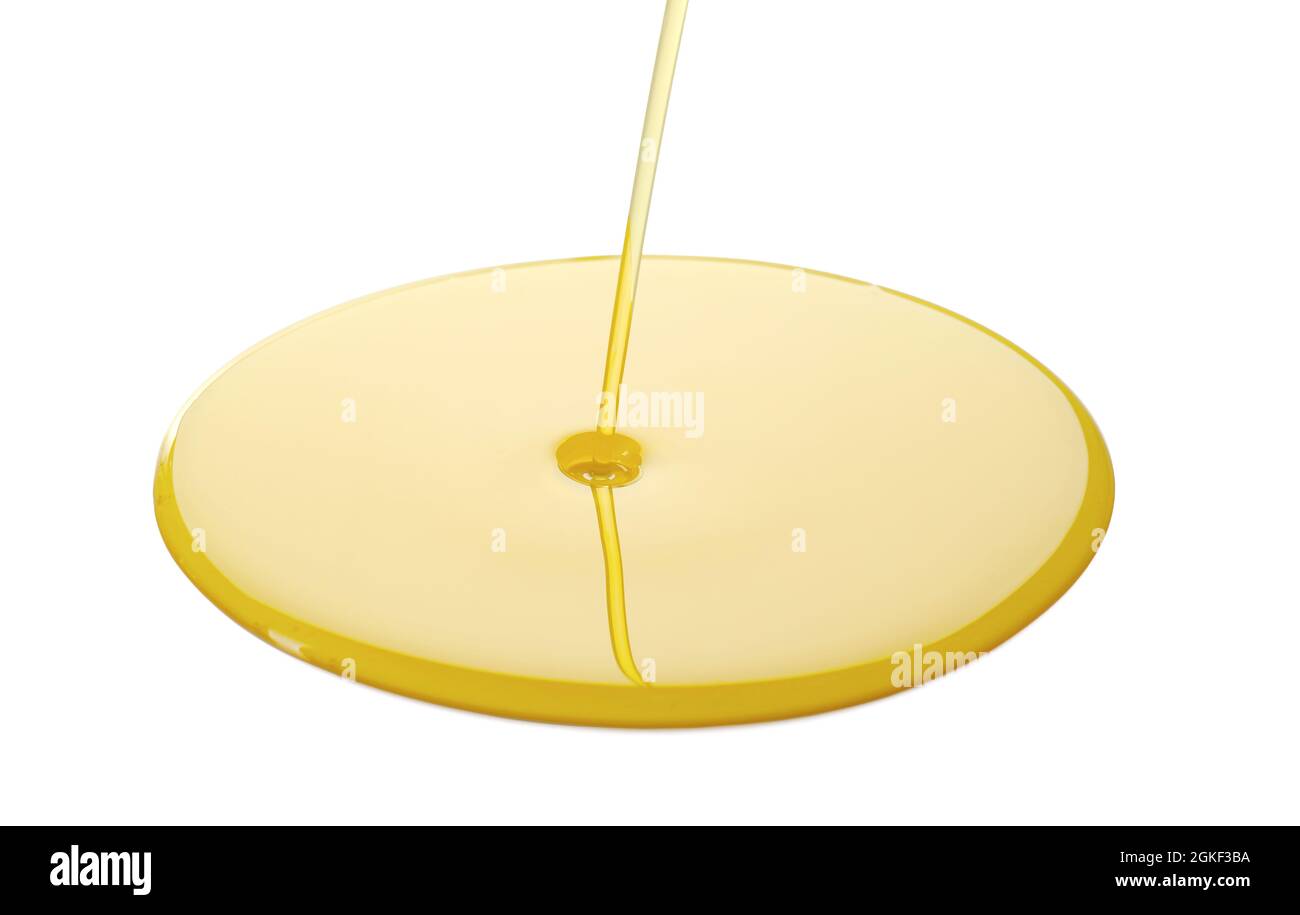 Spilling cooking oil on white background Stock Photo - Alamy