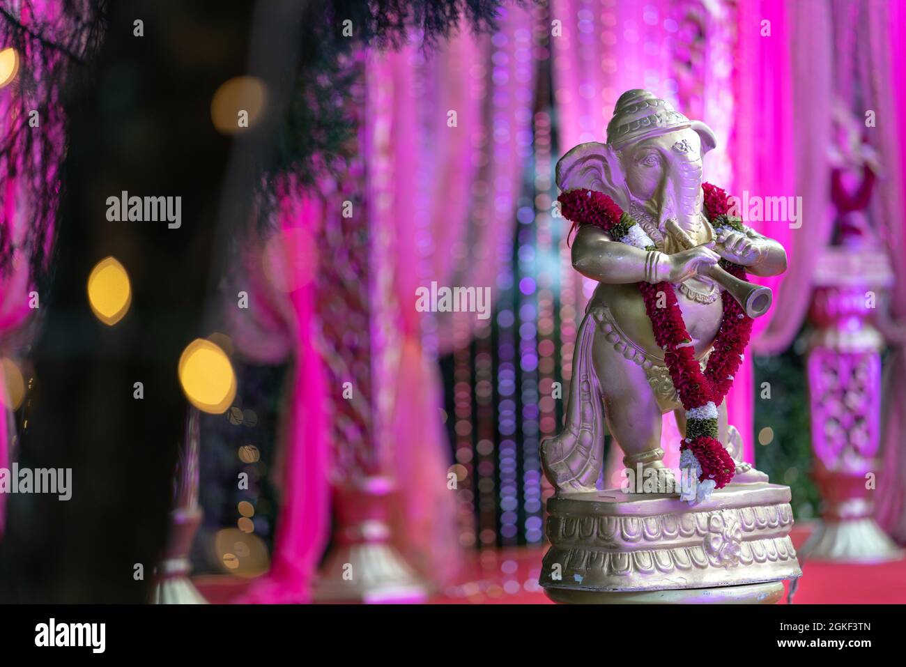 Beautiful statuette of the Indian elephant god Ganesha playing a ...