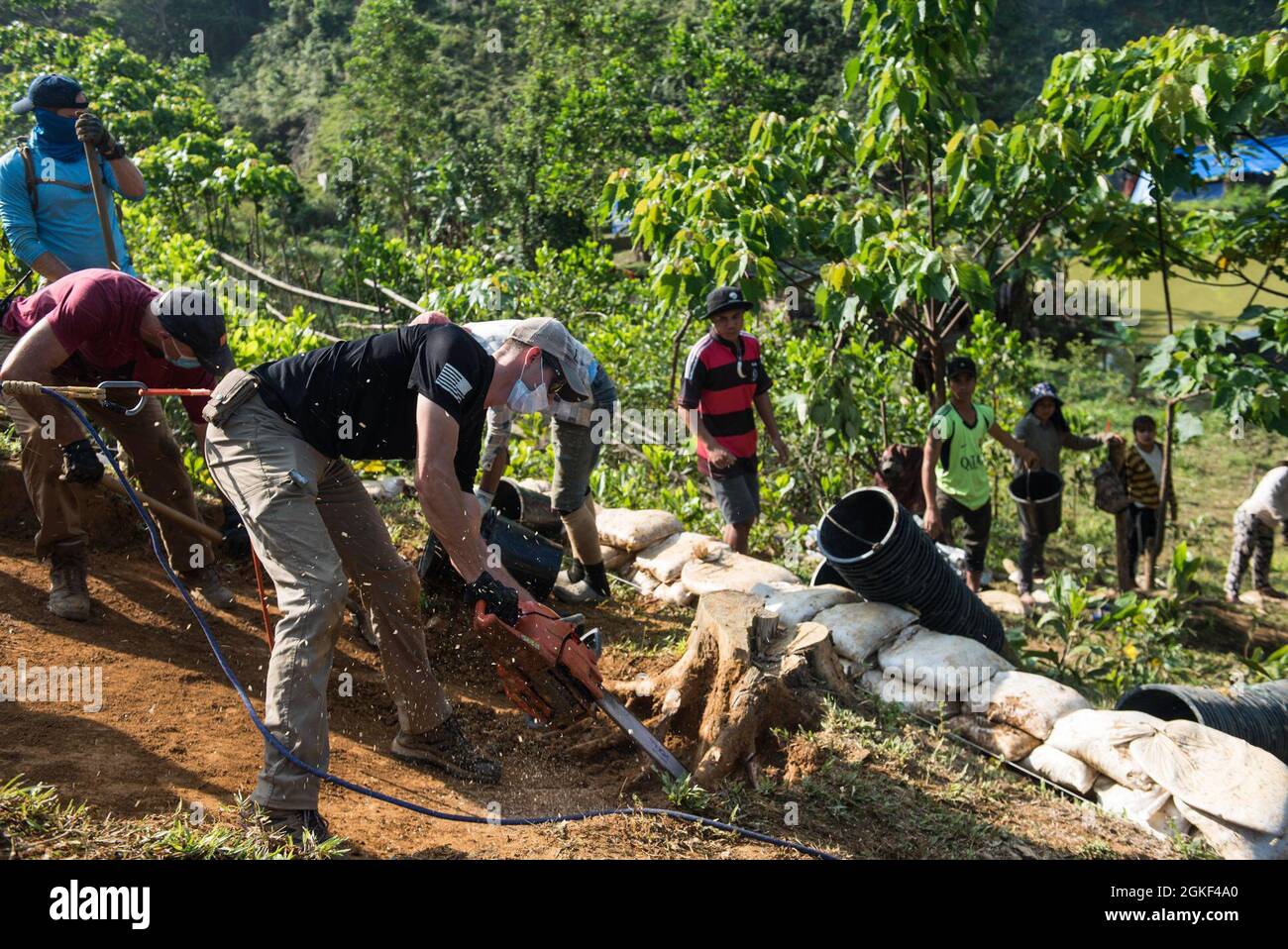 Members of a Defense POW/MIA Accounting Agency (DPAA) recovery team ...
