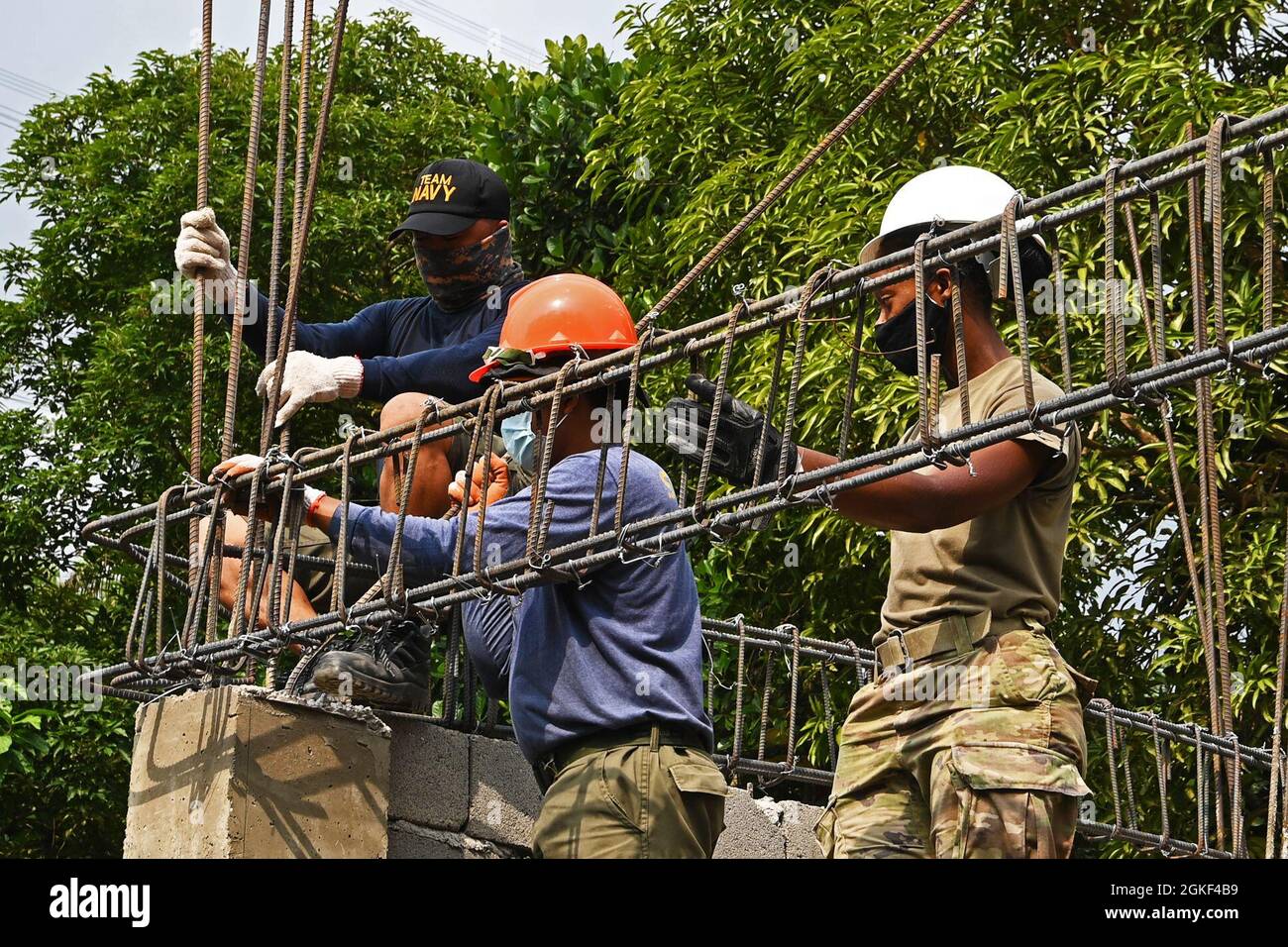 Philippine Navy Seabees with Naval Combat Engineering Brigade and U.S. Army Pfc. Diamond Cousins ...