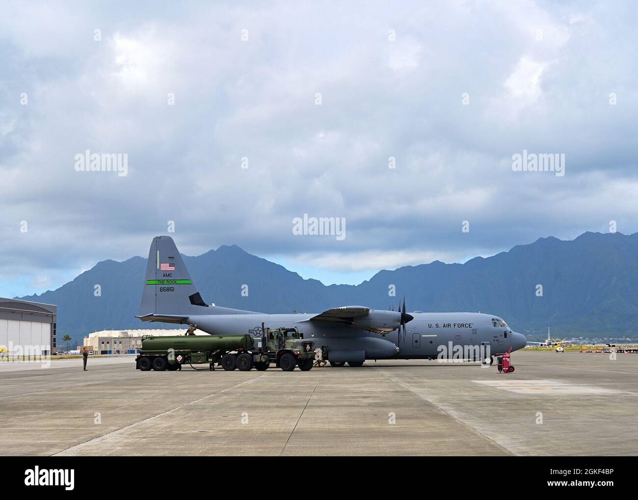 Loadmasters from the 41st Airlift Squadron demonstrate how to perform a ...