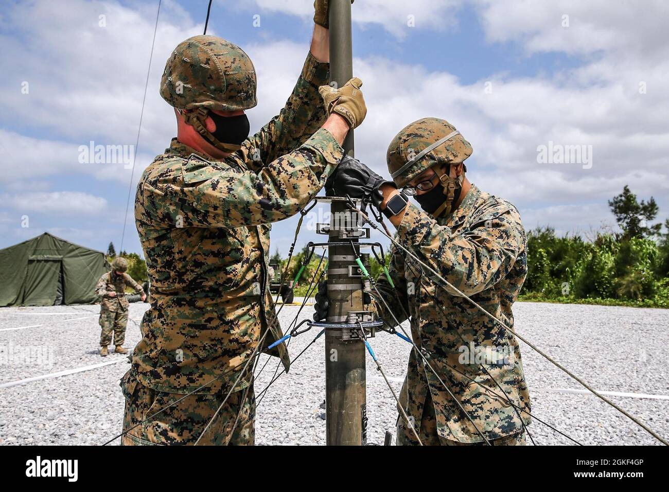 U.S. Marine Corps Sgt. Raphael Mazone, right, data systems ...