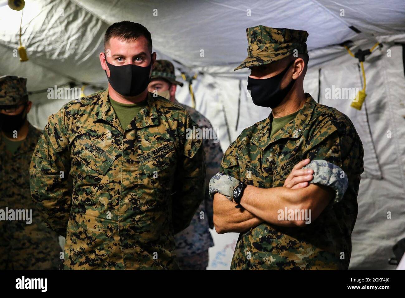 U.S. Marine Corps Cpl. Caleb Horst, left, network administrator with 3d ...