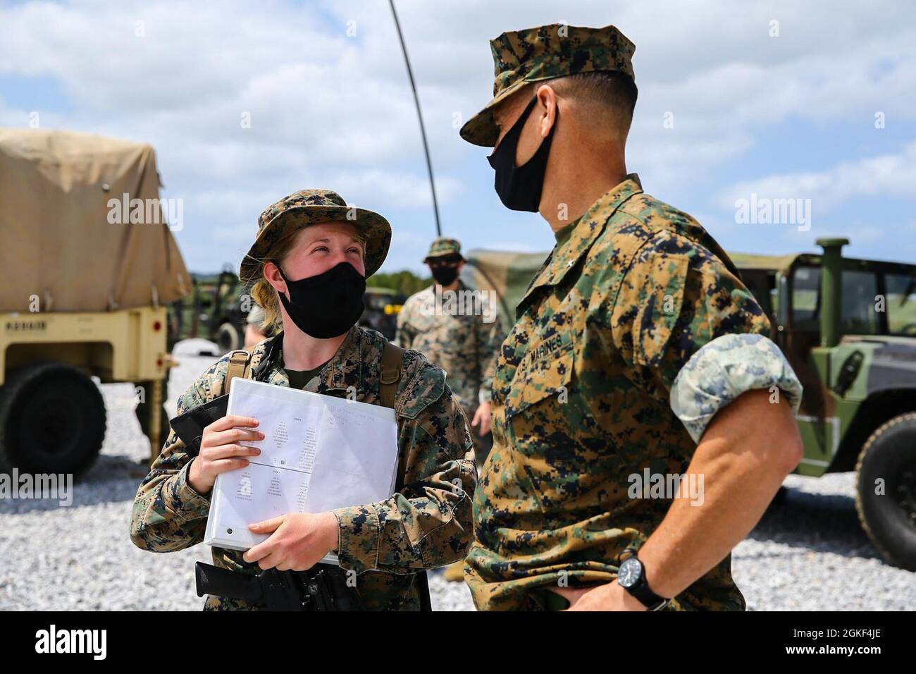 U.S. Marine Corps Sgt. Jillian Gerasimak, left, transmissions system ...