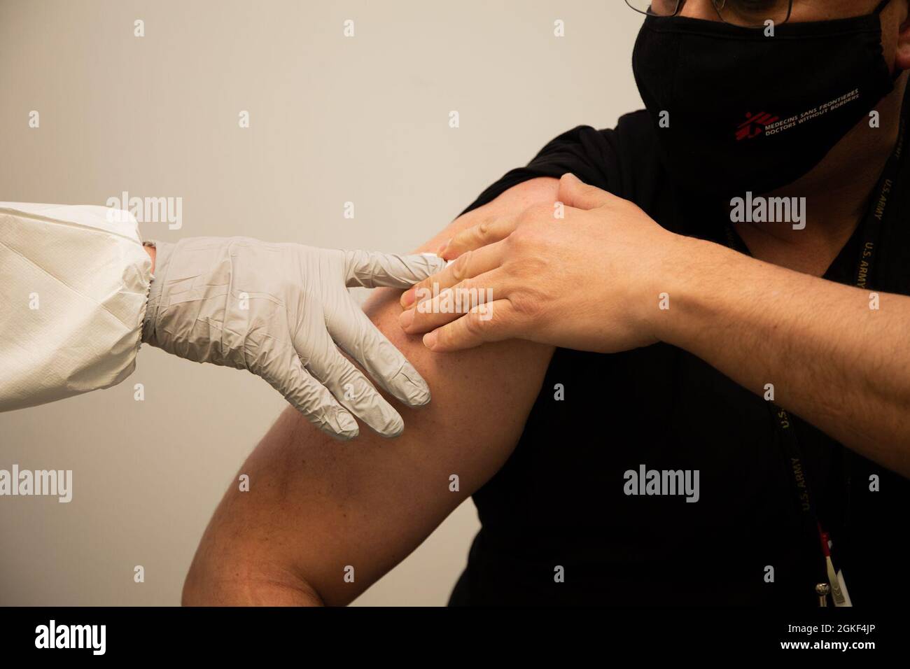 Francis Holinaty receives the first injection of the clinical trial to ...