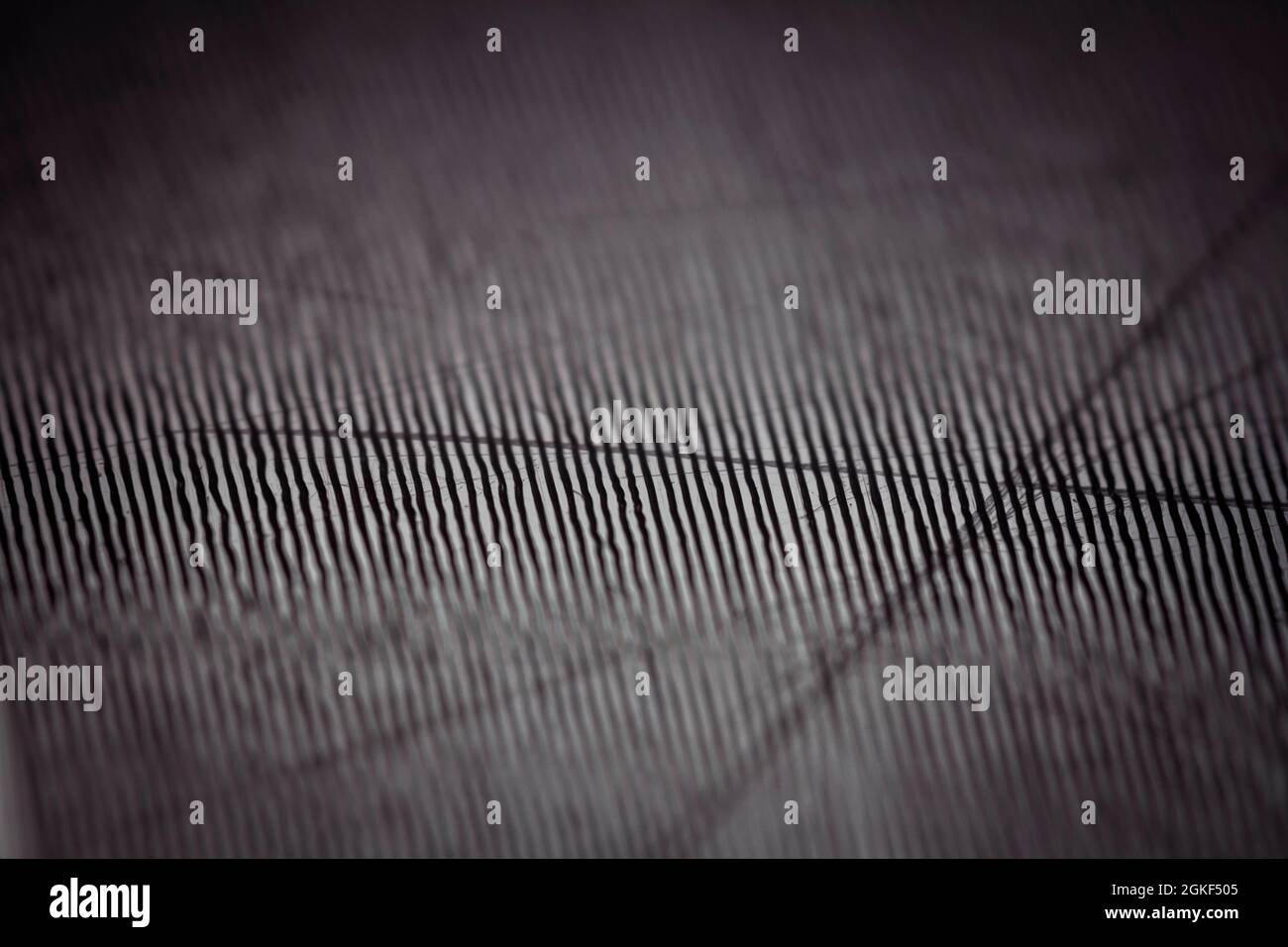 Macro shot of black vinyl record showing scratches. Surface of an old ...