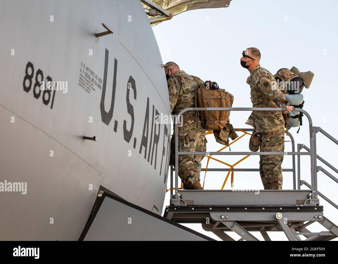 U.S. Airmen from the 151st Air Refueling Wing loads on to a KC-135 ...