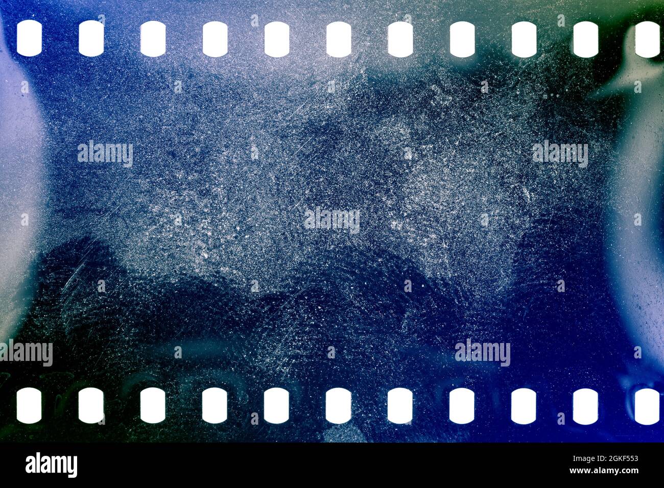 Dusty and grungy 35mm film texture or surface. Perforated camera film ...