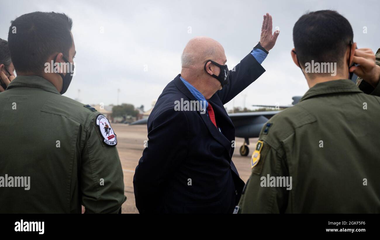 Honorable John P. Roth, acting Secretary of the Air Force, waves at a ...