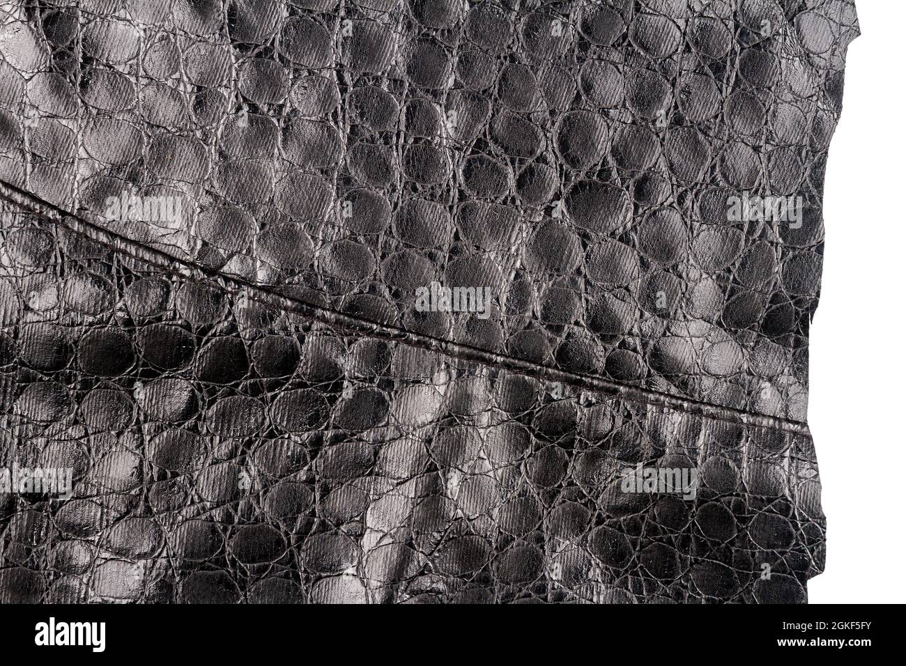 Piece of black artificial leather isolated on white background. Fake ...