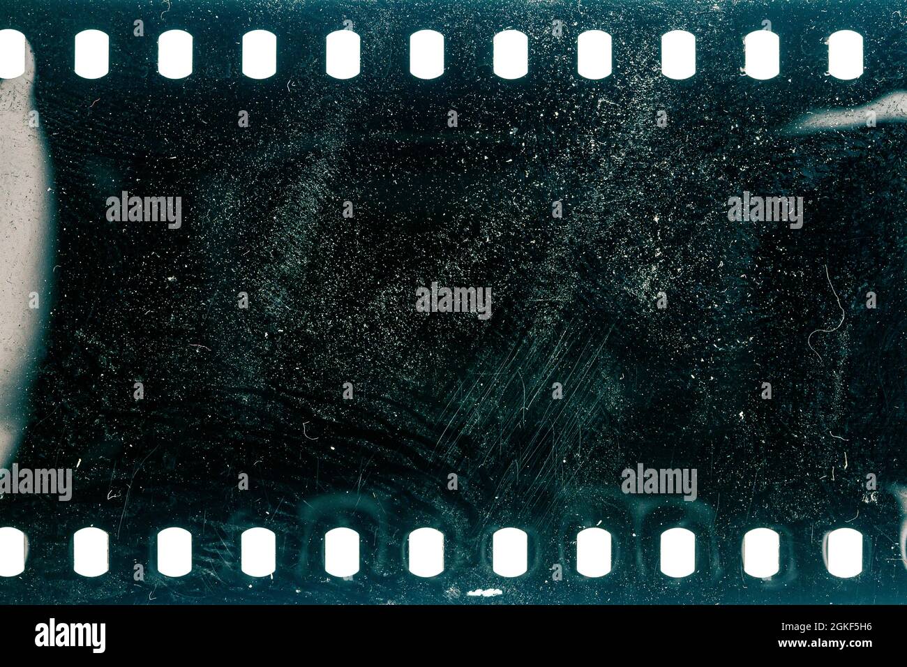 Dusty and grungy 35mm film texture or surface. Perforated camera film ...