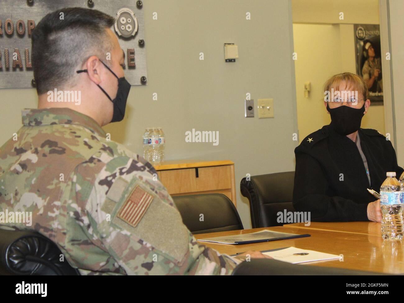 Navy Rear Adm. Pamela Miller, right, converses with Defense Logistics ...