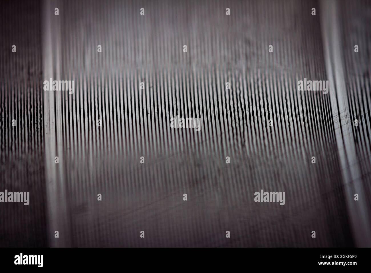 Macro shot of black vinyl record showing scratches. Surface of an old ...