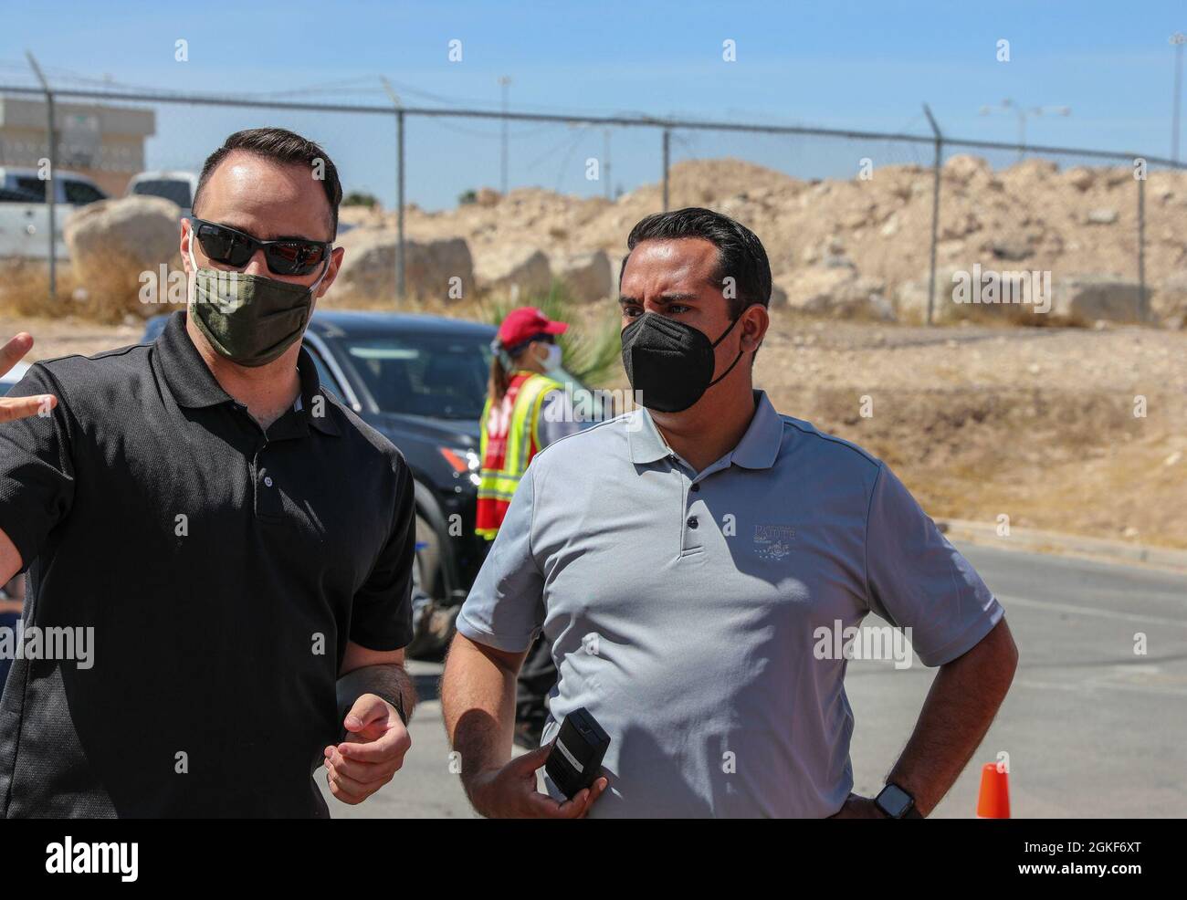 Health and Human Services Director Fabian Solis (right) speaks with Sgt ...