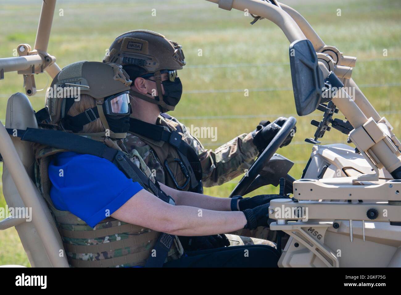 U.S. Air Force Tech. Sgt. Catherine Nelson, back left, drives Julie ...