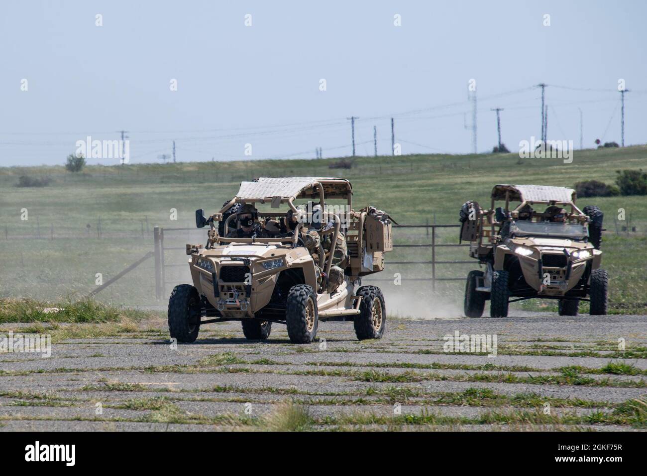 The U.S. Air Force Expeditionary Center command team ride in MRZR all ...