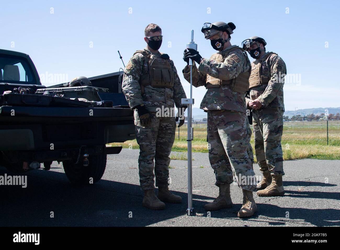 U.S. Air Force Master Sgt. Brad Johannes, left, explains how pavement ...