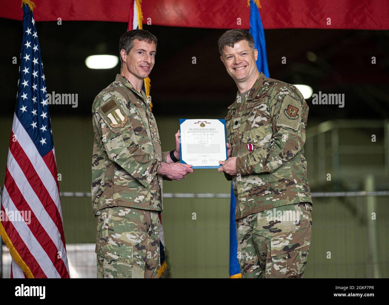 U.S. Air Force Col. Sean Lowe, 48th Operations Group commander, left, presents Lt. Col. Ryan ...