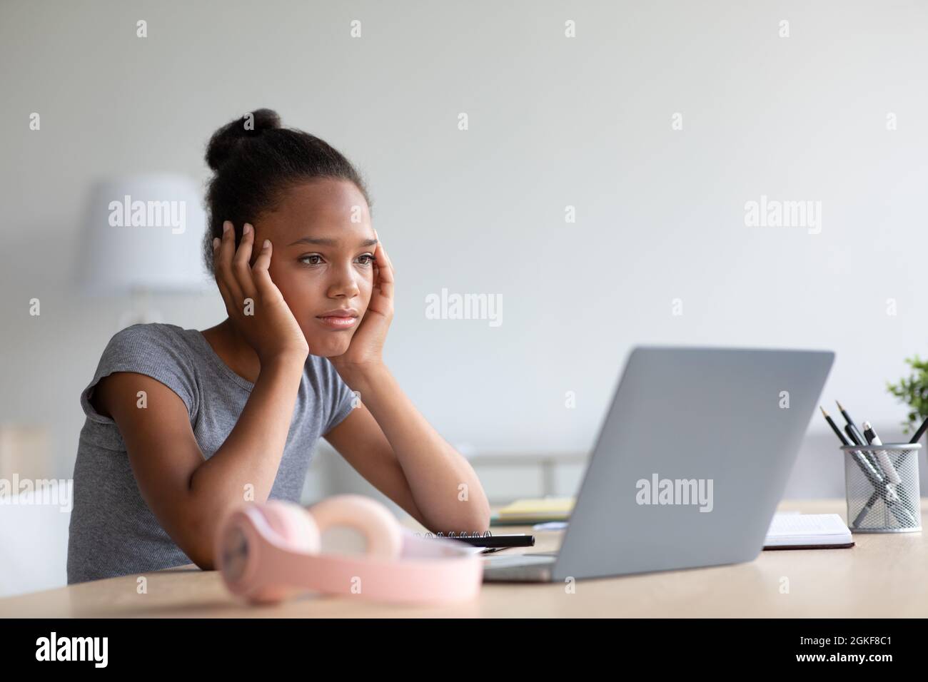 Sad tired bored pretty teenager african american girl pupil in ...