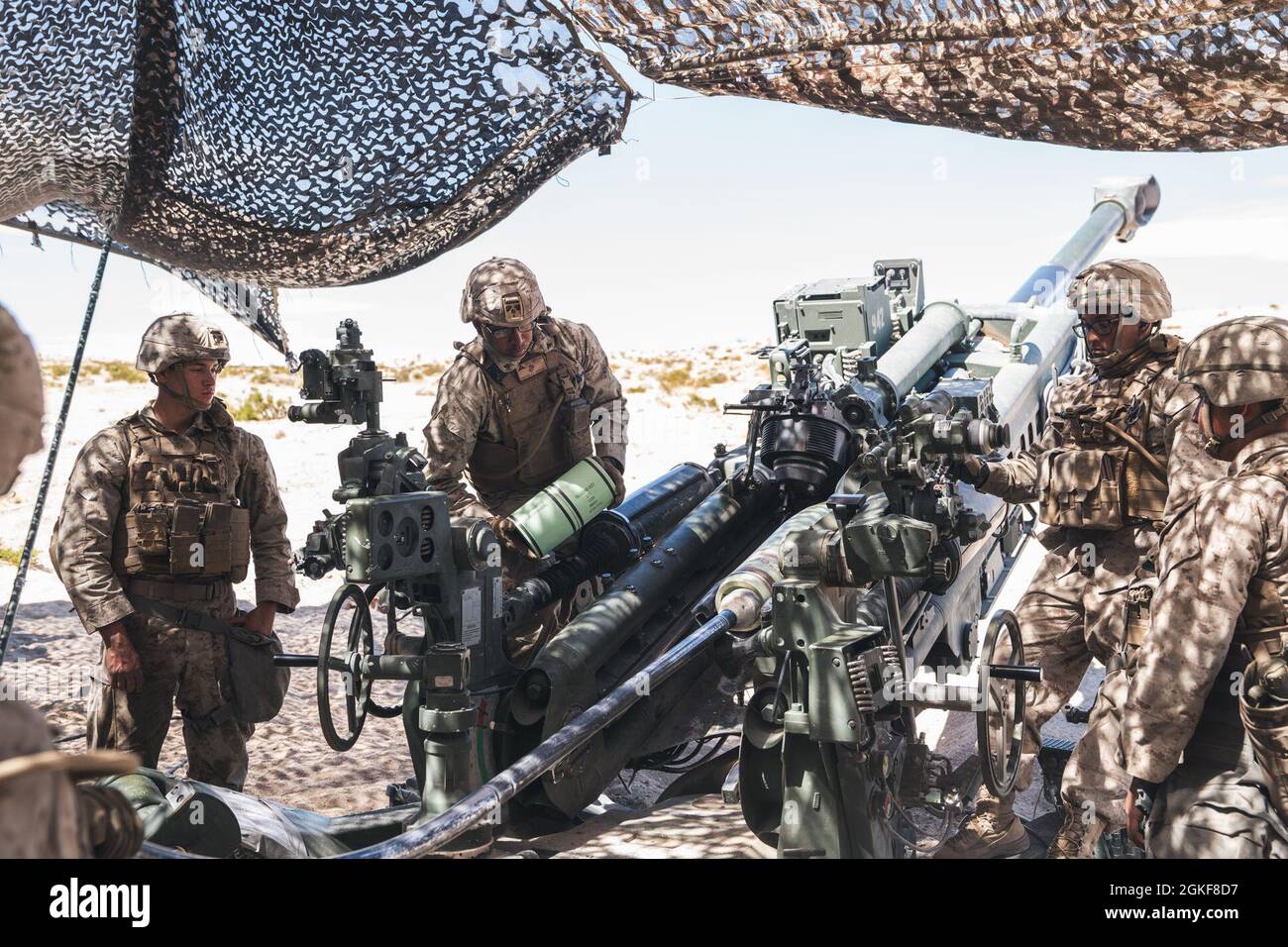 U.S. Marines with 1st Battalion, 11th Marine Regiment, load an M777 ...