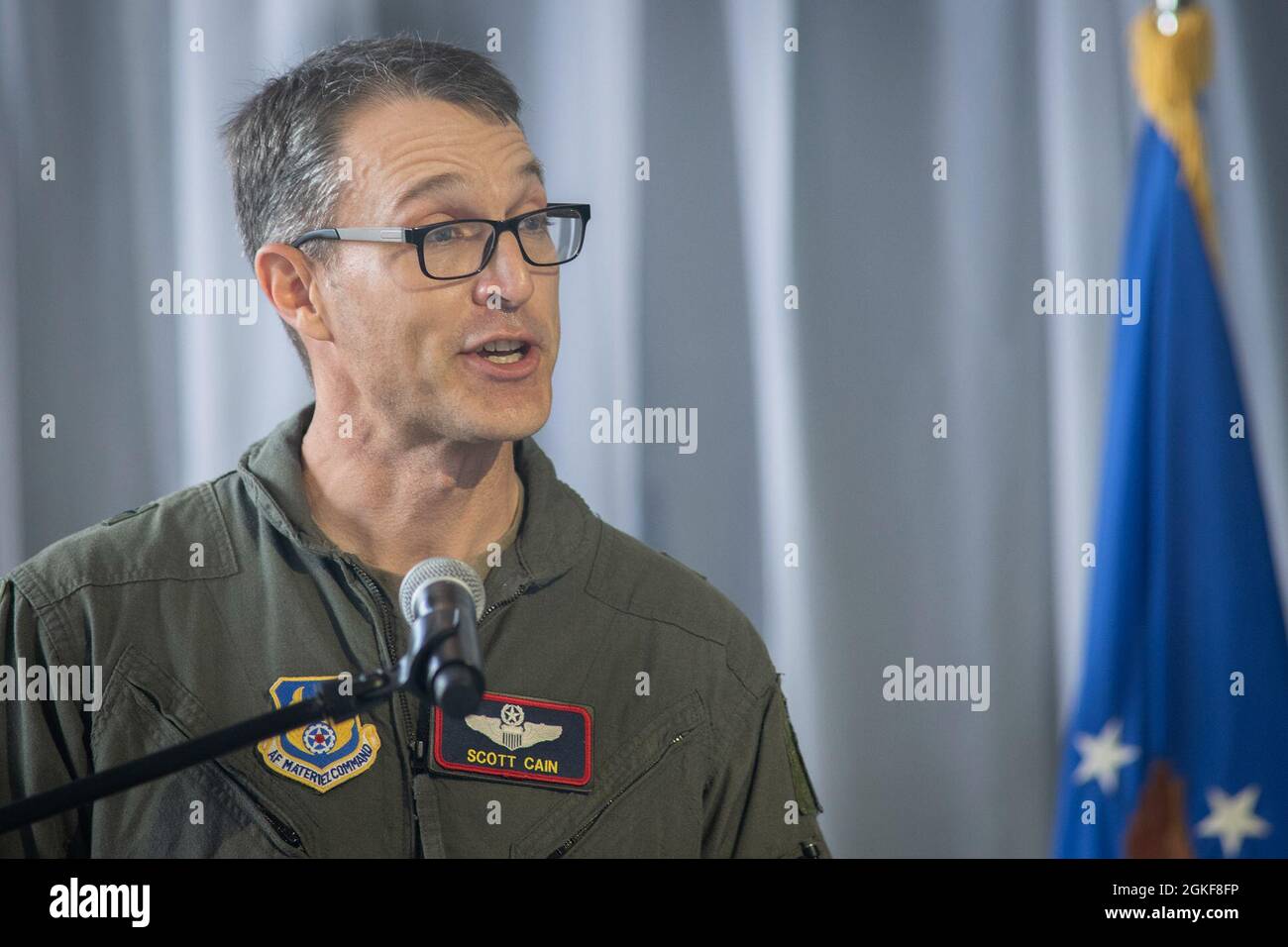 Brig. Gen. Scott Cain, 96th Test Wing commander, speaks to the audience ...