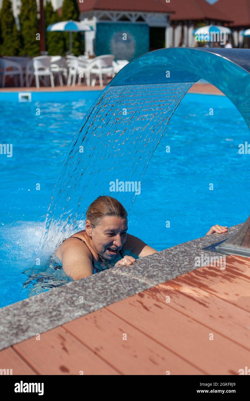 Woman spa waterfall pool hi-res stock photography and images - Alamy