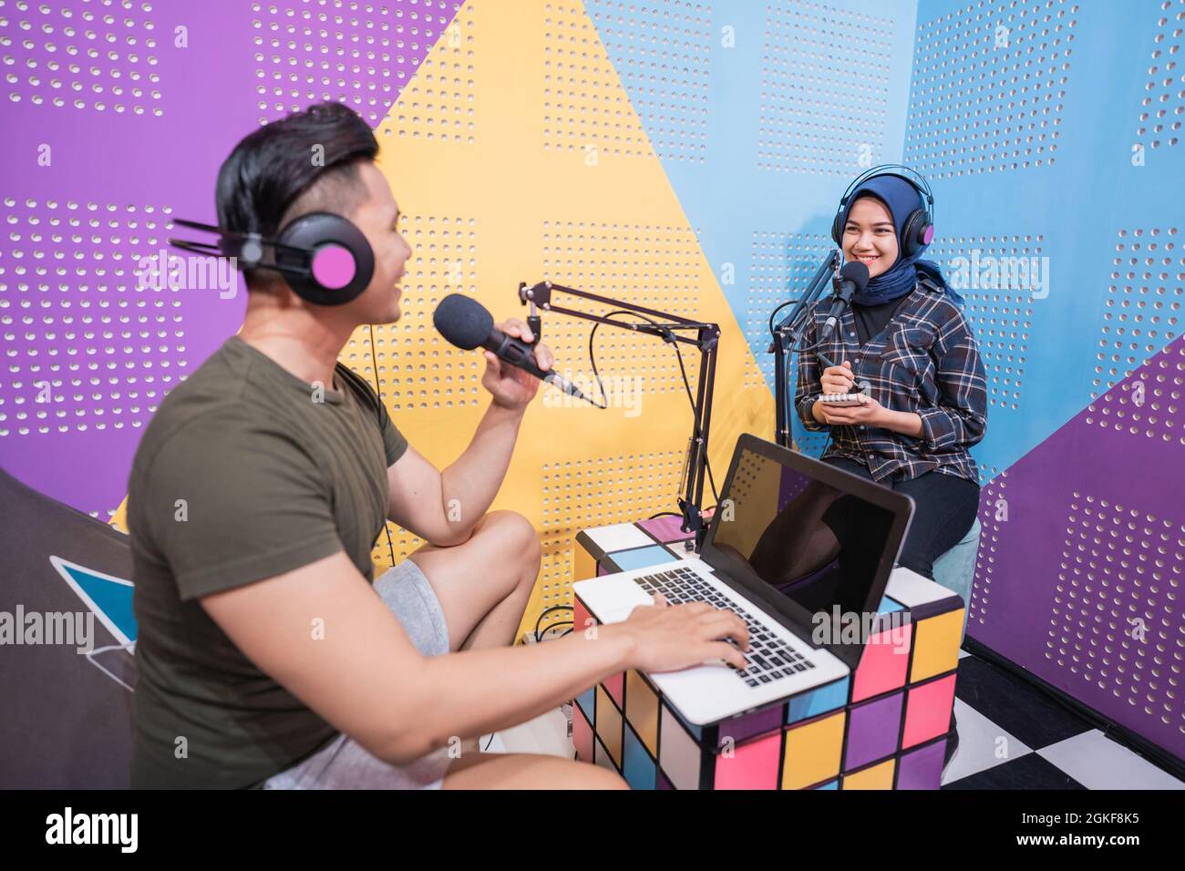 man and woman during live interview in podcast studio together Stock ...