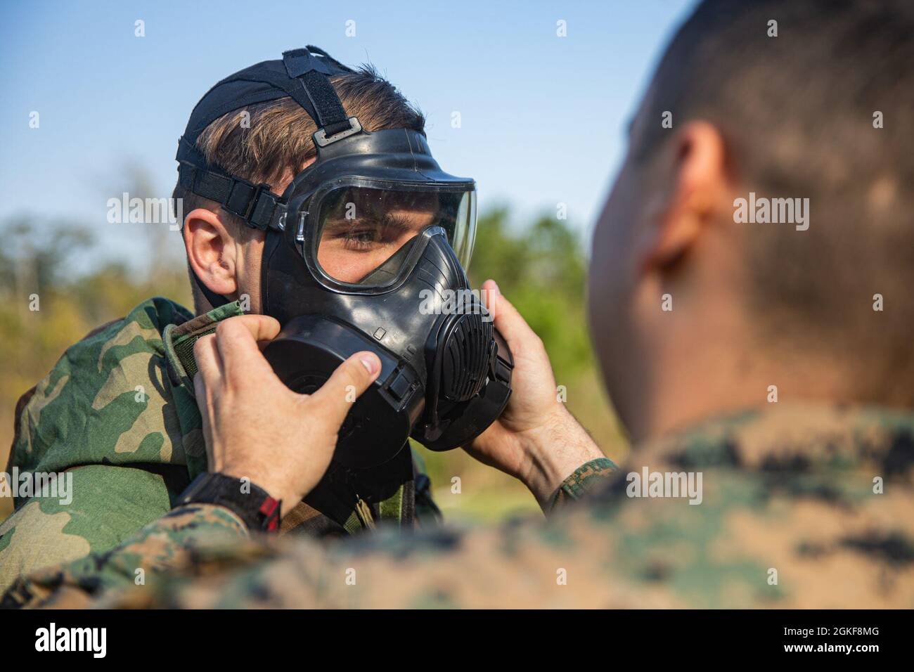 U.S. Marine Corps Lance Cpl. Noah Olof checks the seal of Lance Cpl ...