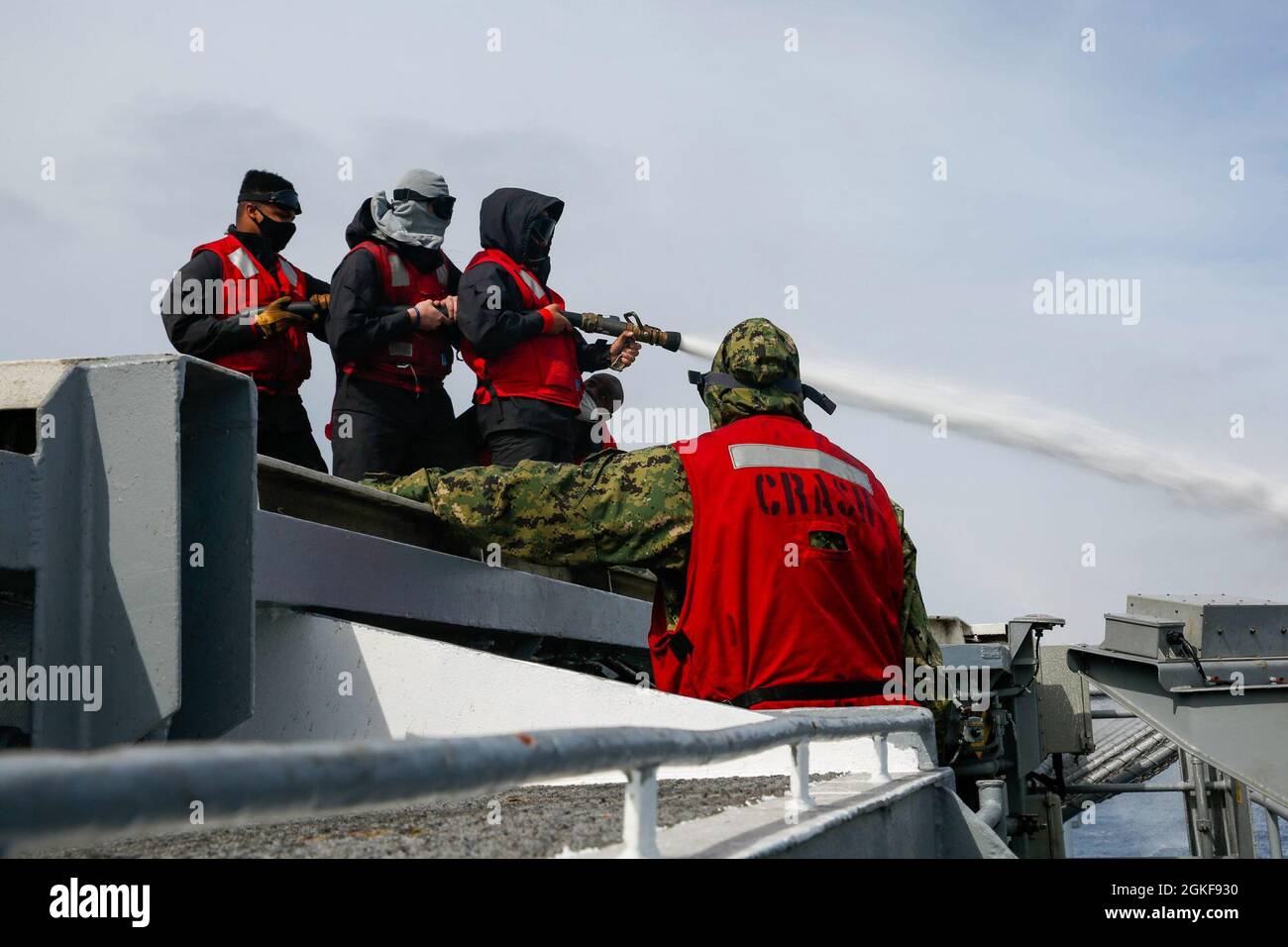 210407-N-MM912-1085 PACIFIC OCEAN (April 7, 2021) Sailors man an ...