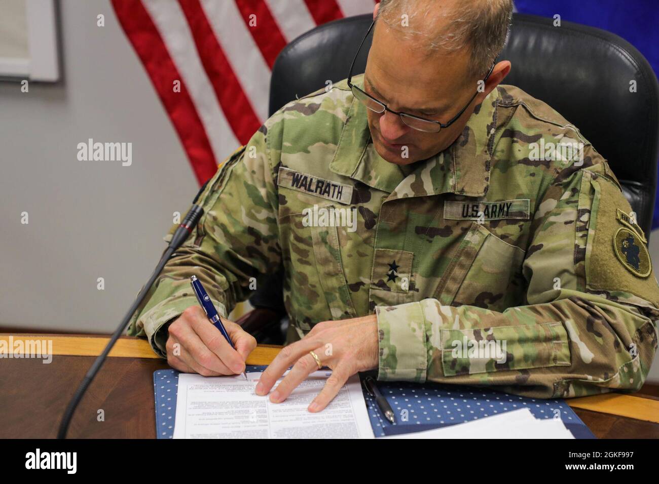 Maj. Gen. Daniel R. Walrath, Army South commanding general, signs the ...