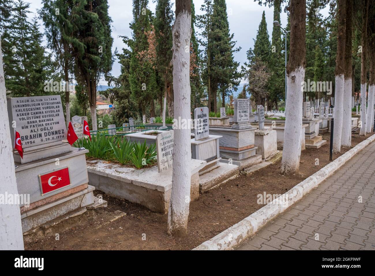 Birgi, Izmir, Turkey - 03.09.2021: Turkish graveyard with trees and ...
