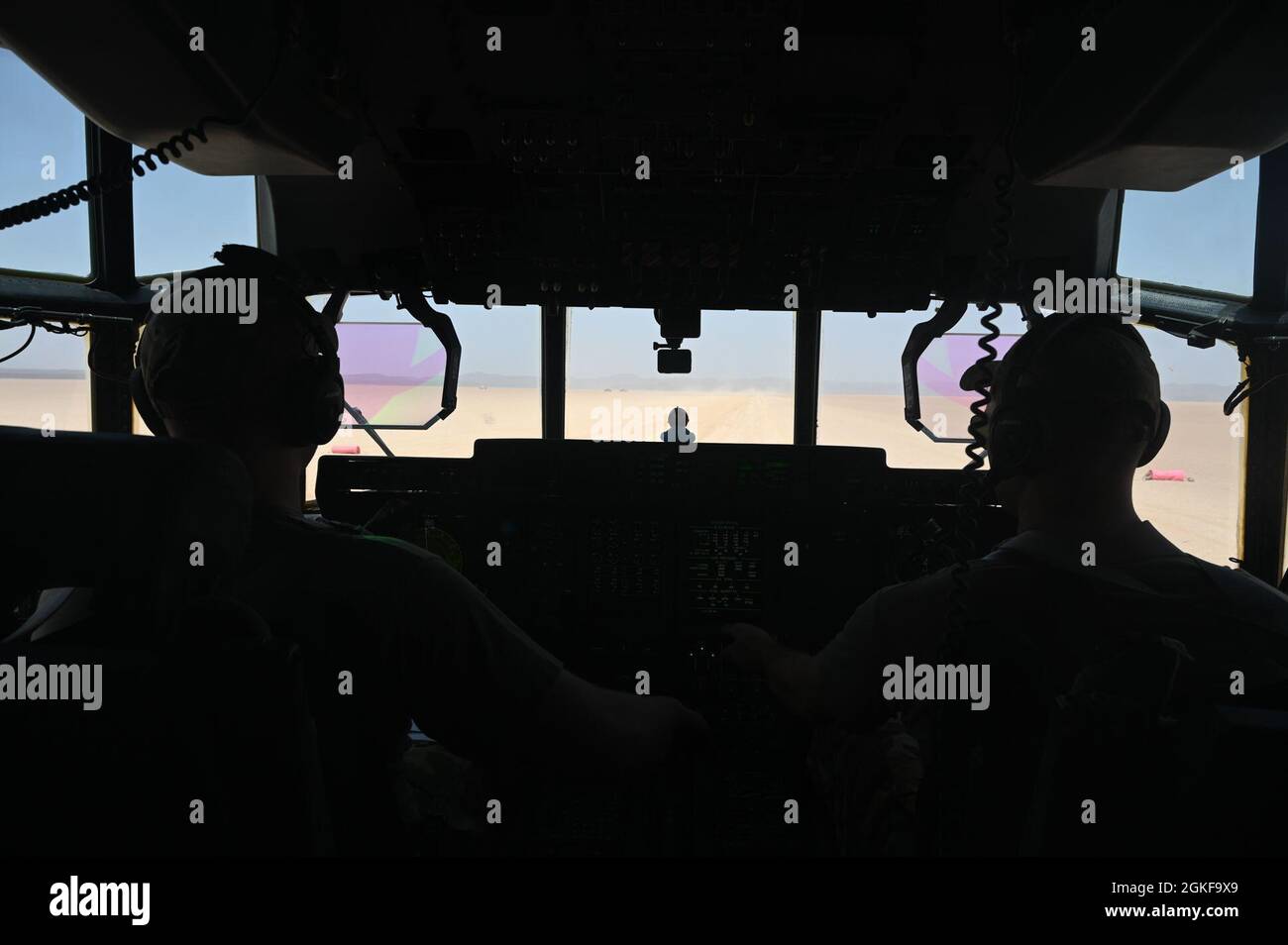 U.S. Air Force Capt. Andrew Theiss, and 1st Lt. Daniel Bogue, C-130J ...