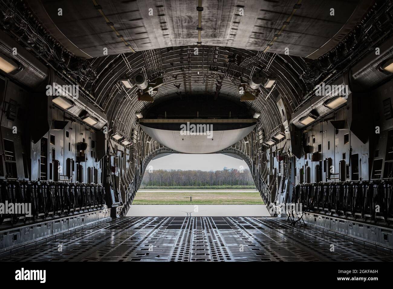 The ramp of a C-17 Globemaster III is positioned in the drive-in mode ...