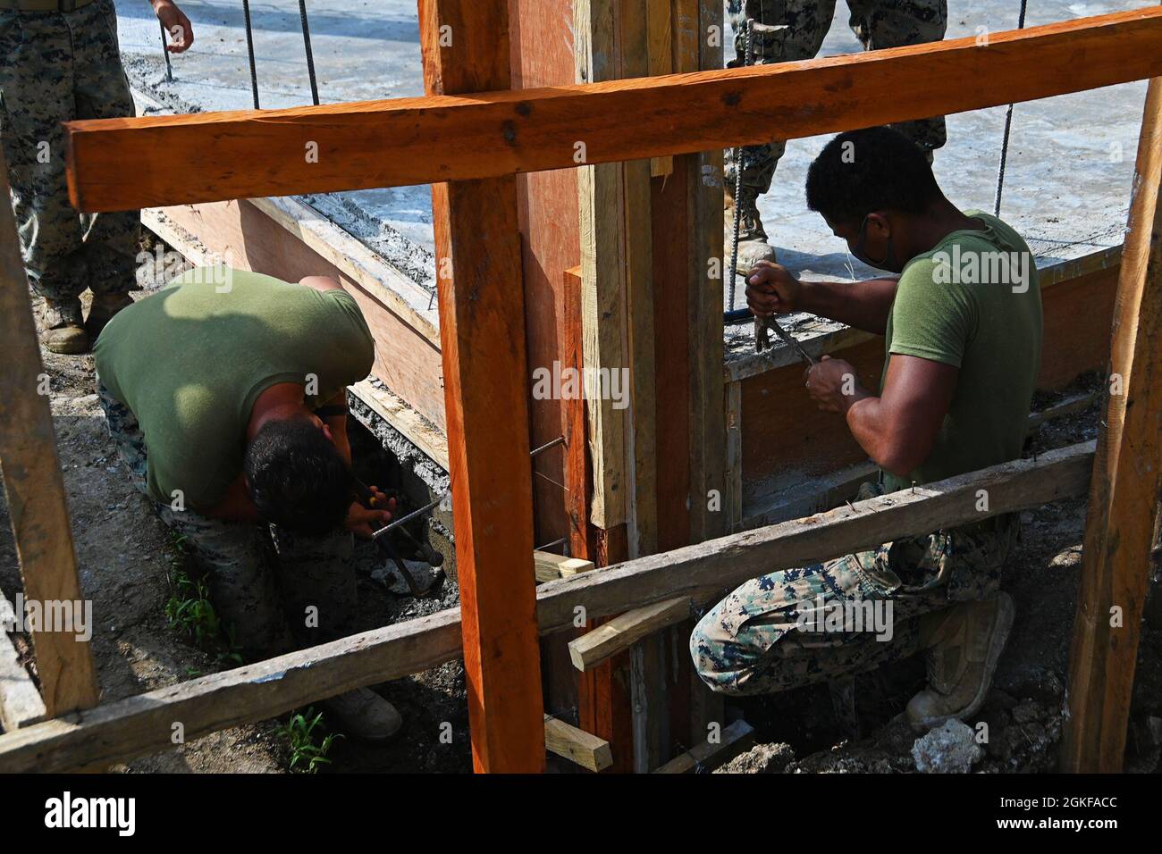 U.S. Marine Corps Cpl. Mason Hebb (left), 9th Engineer Support ...