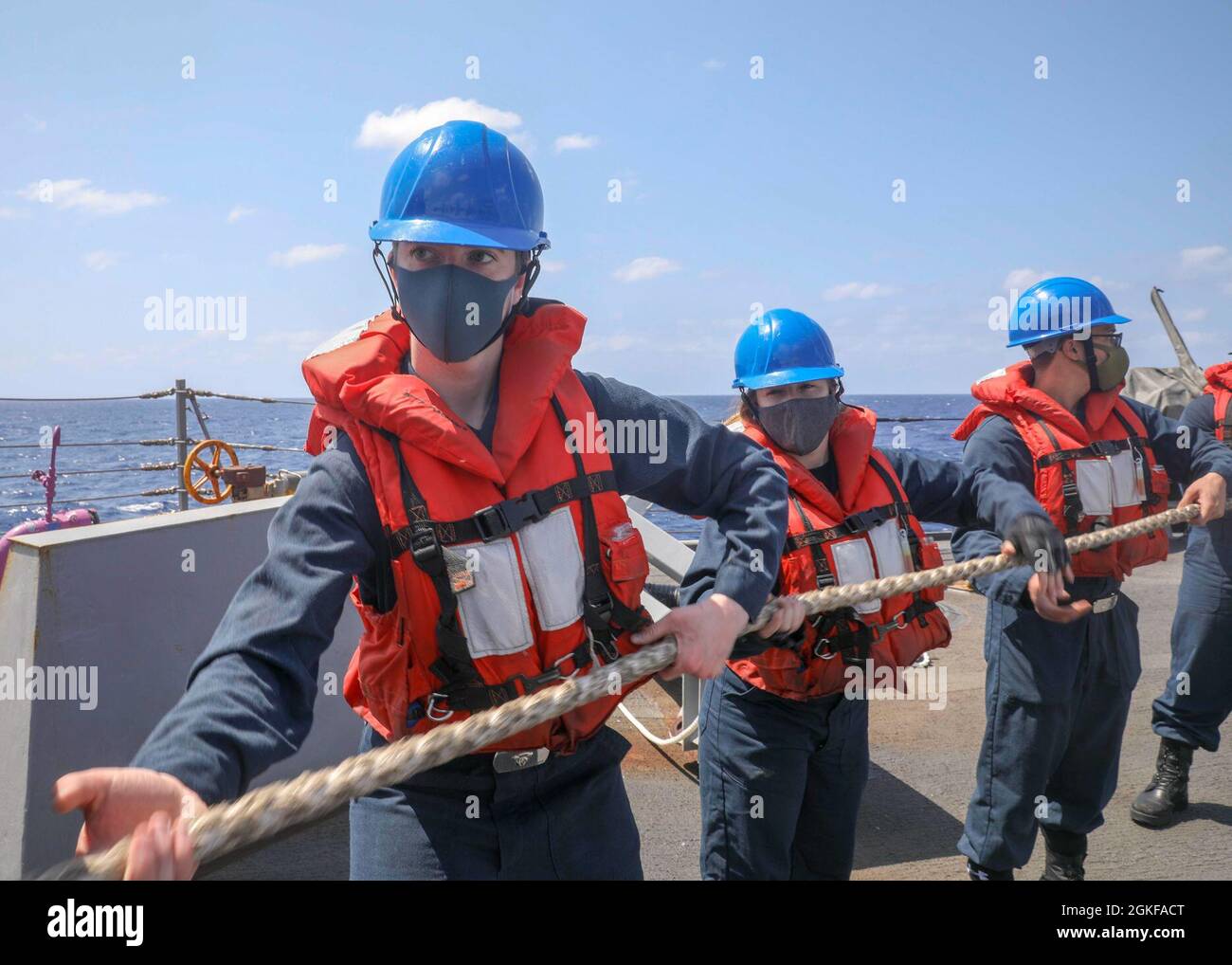 PHILIPPINE SEA (April 7, 2021) Sailors heave a line on the fantail of ...