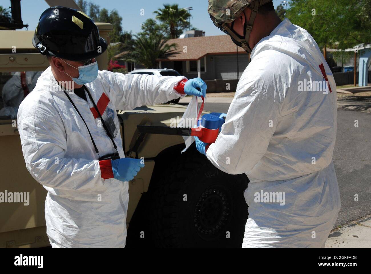 An FBI Hazardous Evidence Response Team member places the location ...