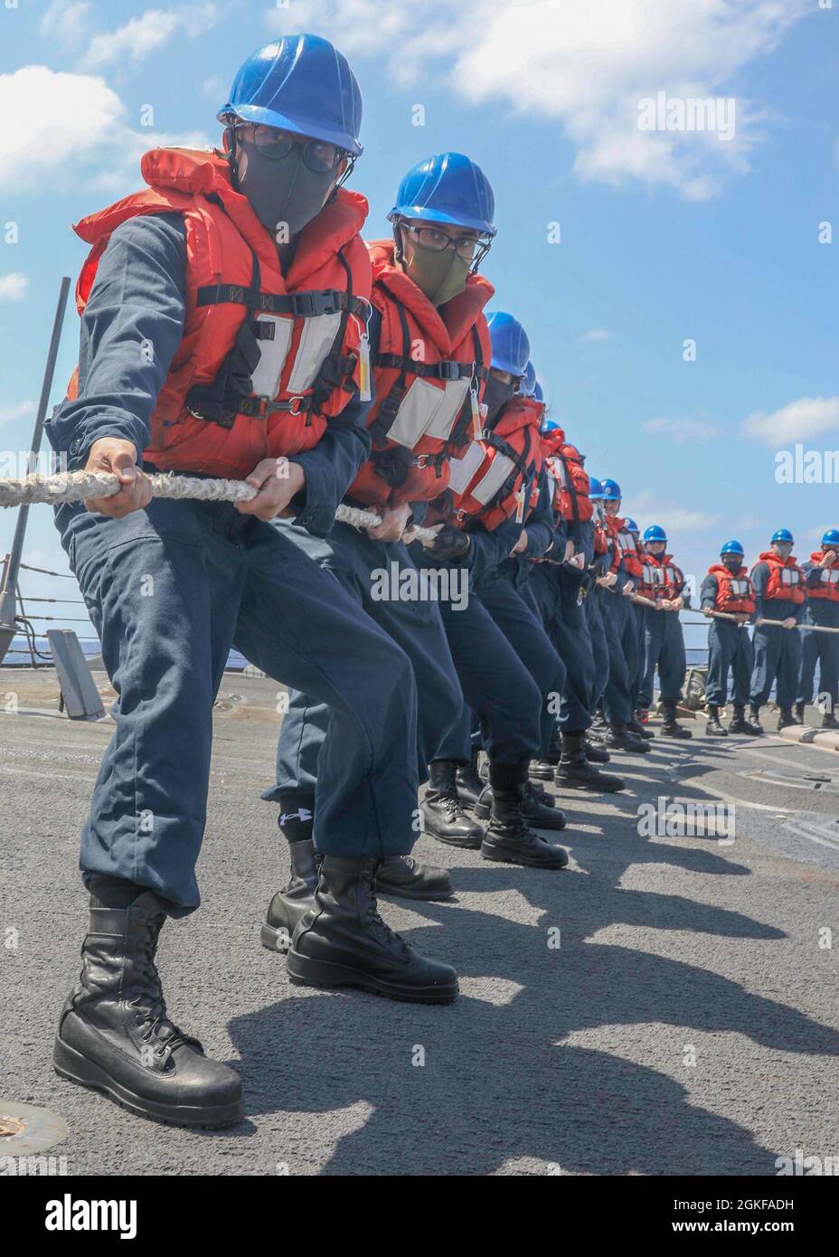 PHILIPPINE SEA (April 7, 2021) Sailors heave a line on the fantail of ...