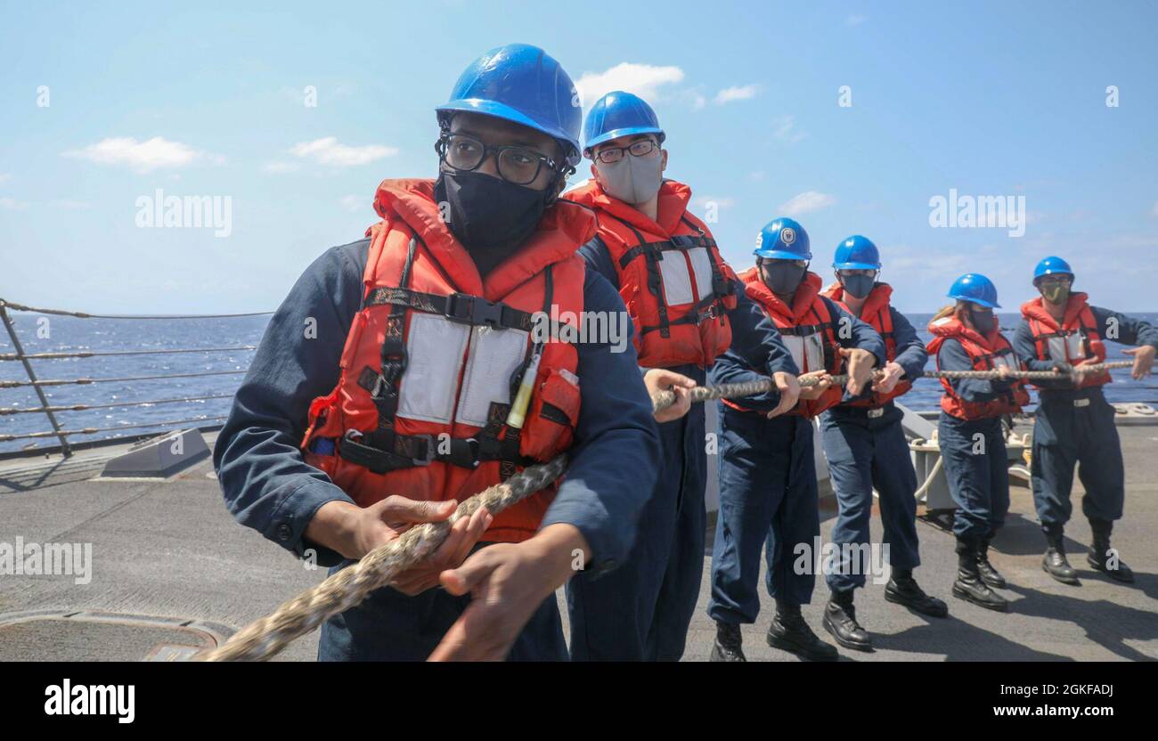 PHILIPPINE SEA (April 7, 2021) Sailors heave a line on the fantail of ...