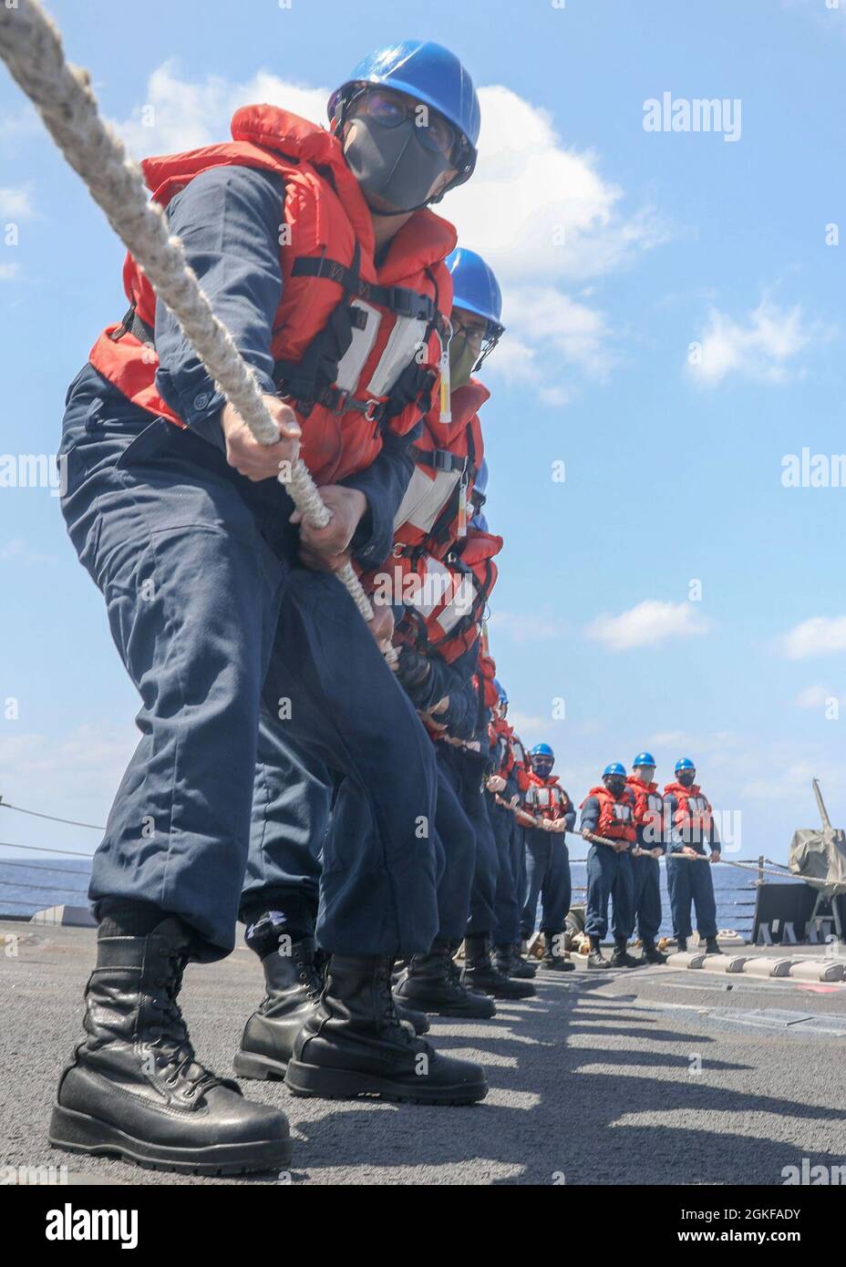 PHILIPPINE SEA (April 7, 2021) Sailors heave a line on the fantail of ...