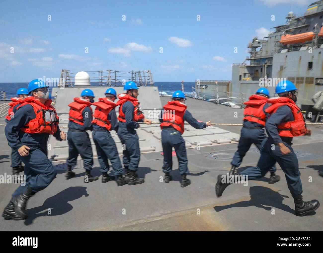 PHILIPPINE SEA (April 7, 2021) Sailors heave a line on the fantail of ...