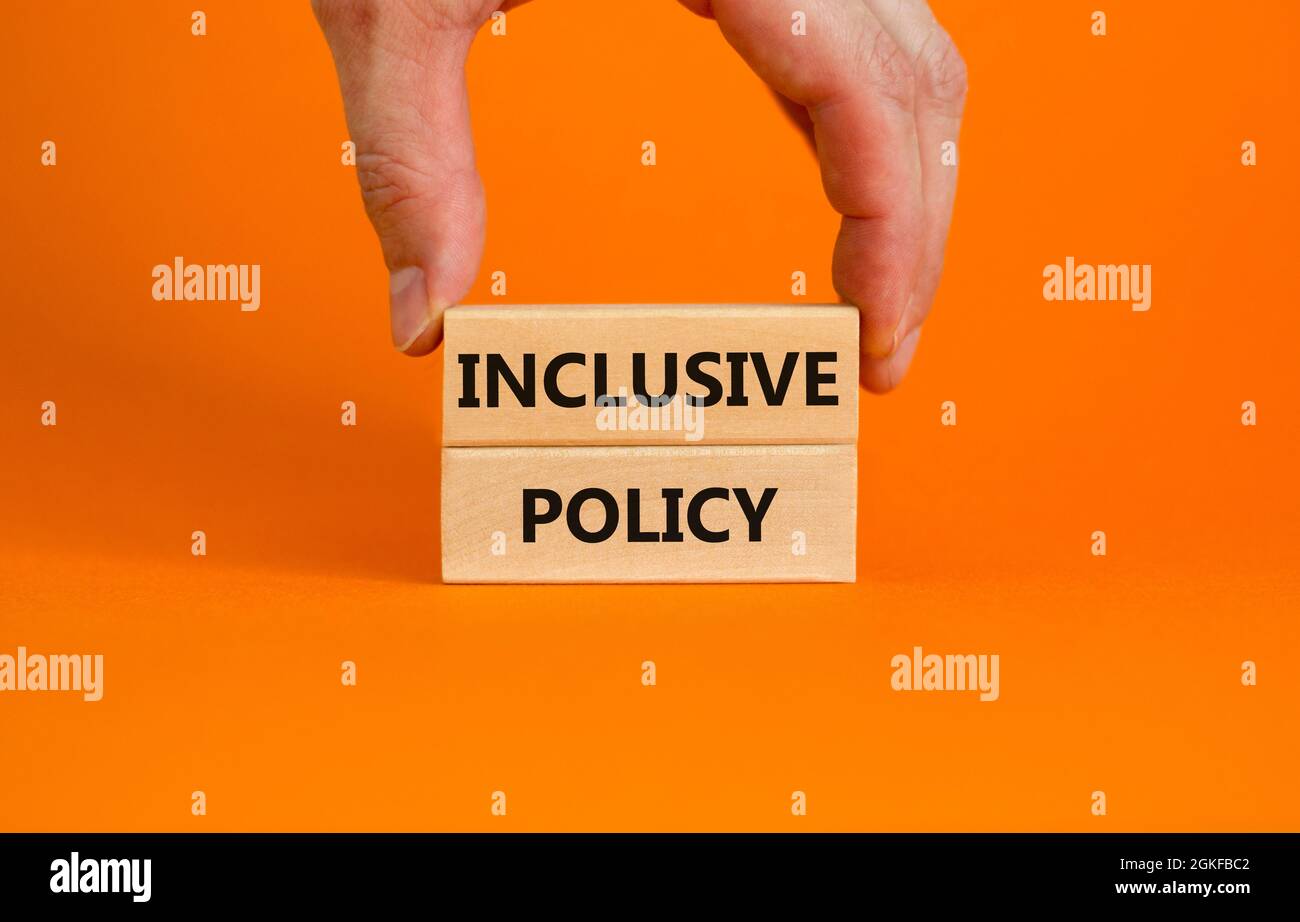 Inclusive policy symbol. Wooden blocks with words Inclusive policy on ...