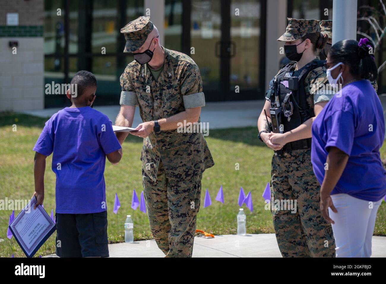 U.S. Marine Corps Col. Curtis V. Ebitz, center, the commanding officer ...