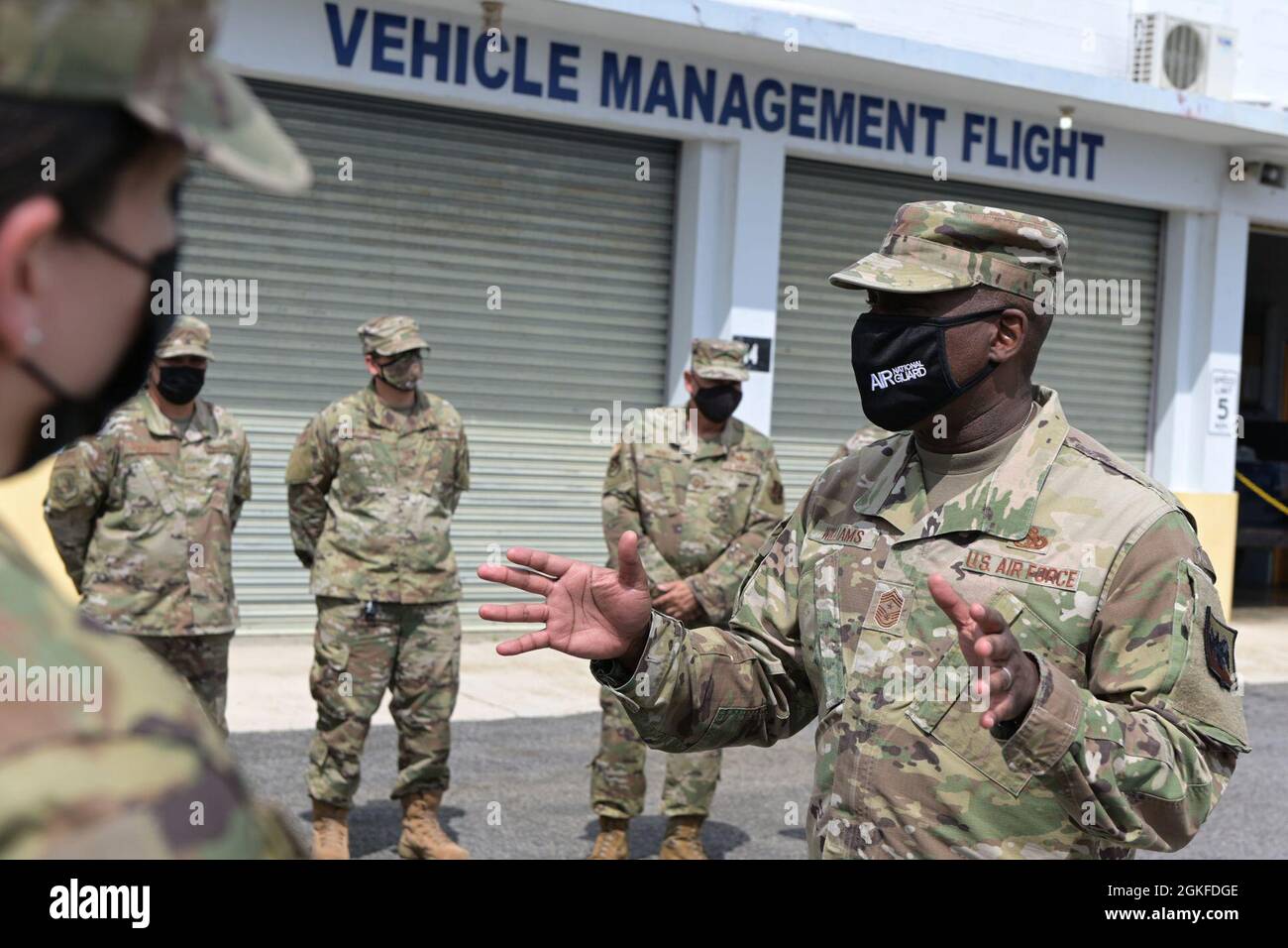 U.S. Air Force Chief Master Sgt. Maurice L. Williams, center, command ...