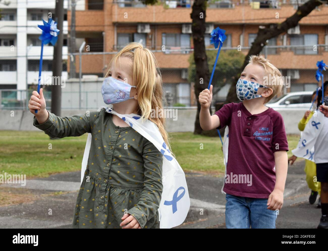Reyna Coleman, 5, left, and William Jamieson, 4, watch their pinwheels ...