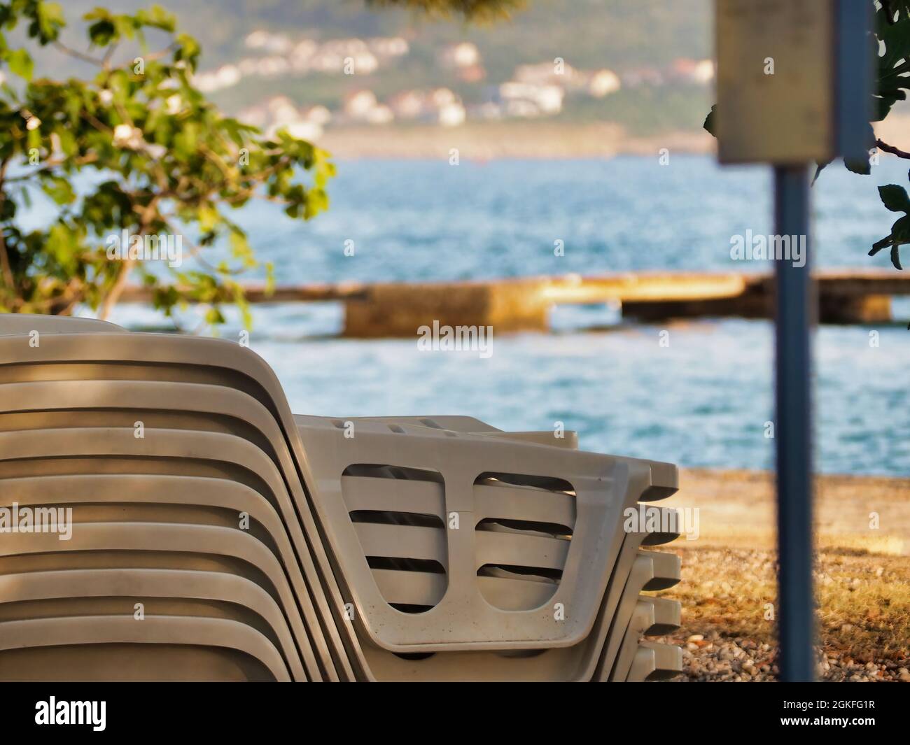 Pool benches on the beach Stock Photo - Alamy