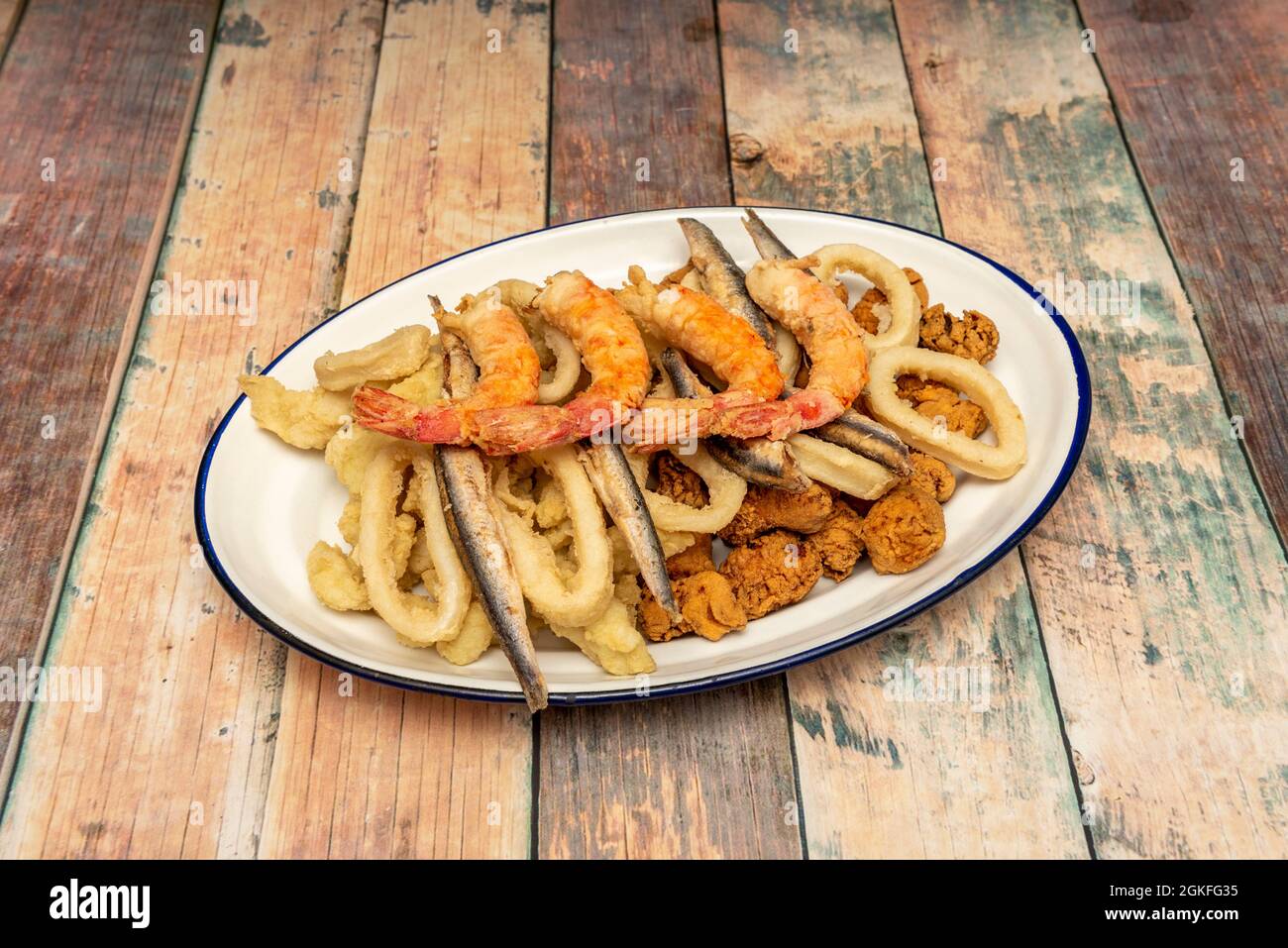 Great Andalusian fish and seafood frying. Peeled red shrimp in tempura ...