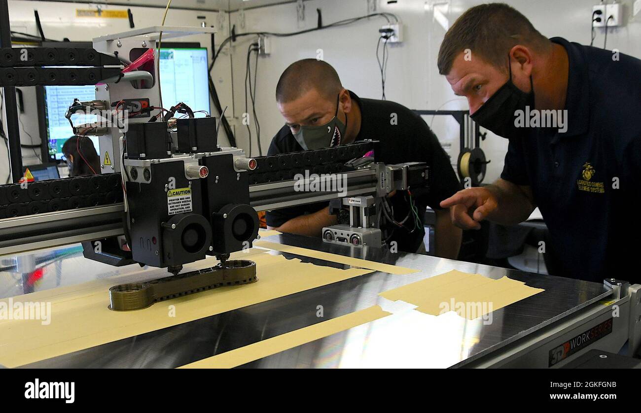 Robert Davies (left), project officer for Fabrication Equipment, from ...