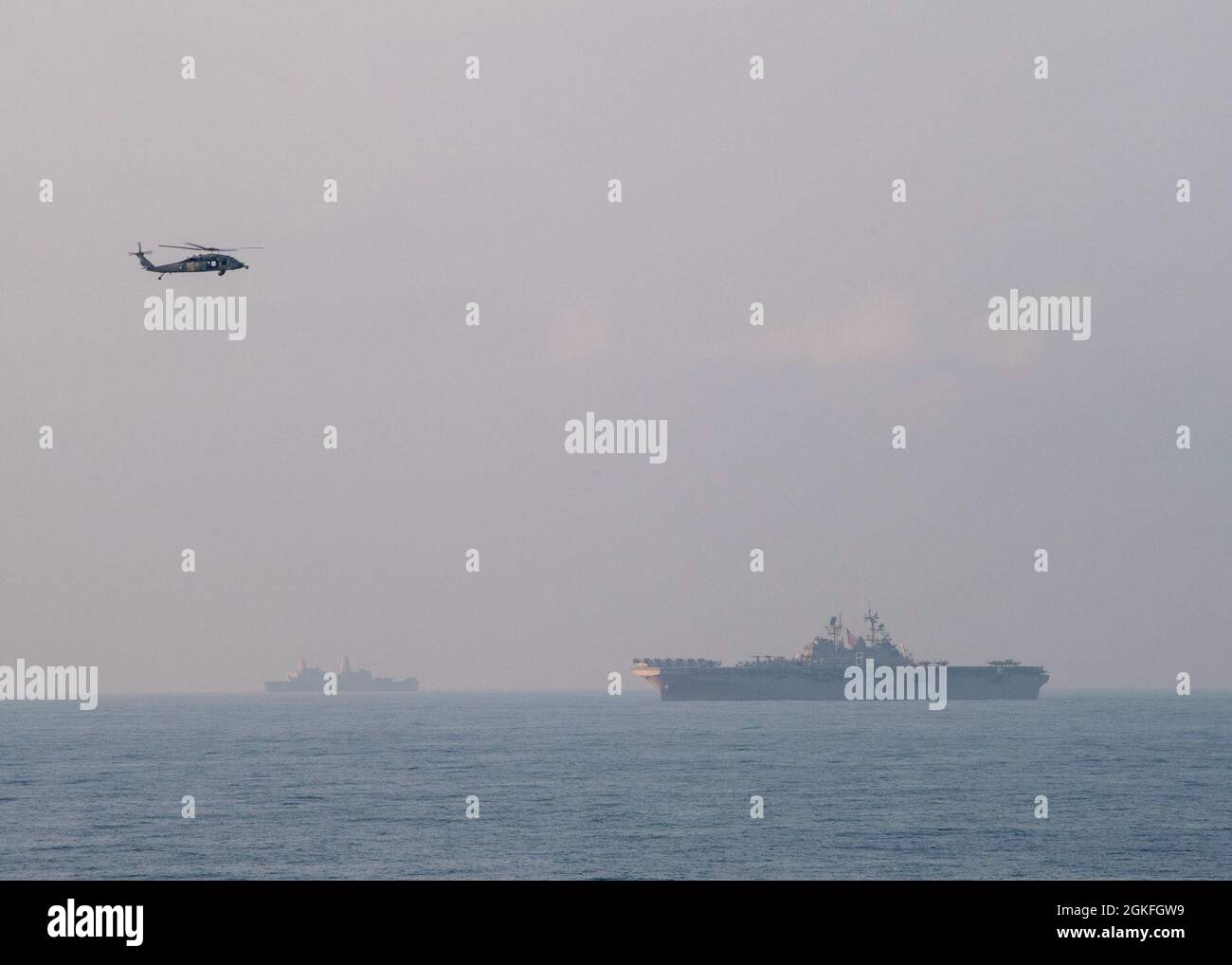 SOUTH CHINA SEA (April 9, 2021) An MH-60S Sea Hawk, assigned to the ...