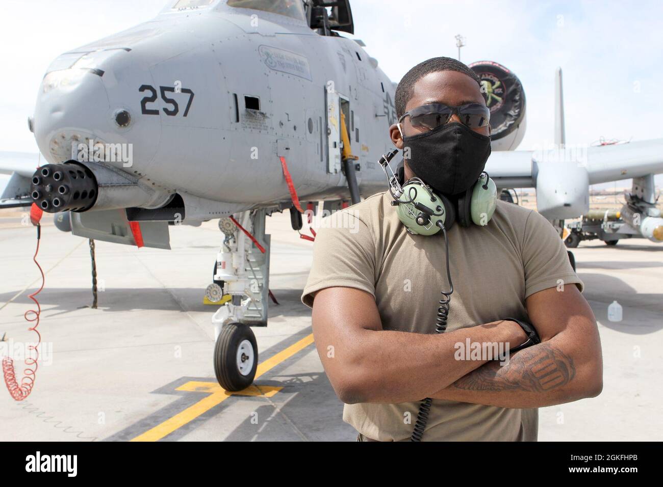 Senior Airman Maurice Starks stand in front of an A-10 Thunderbolt II ...