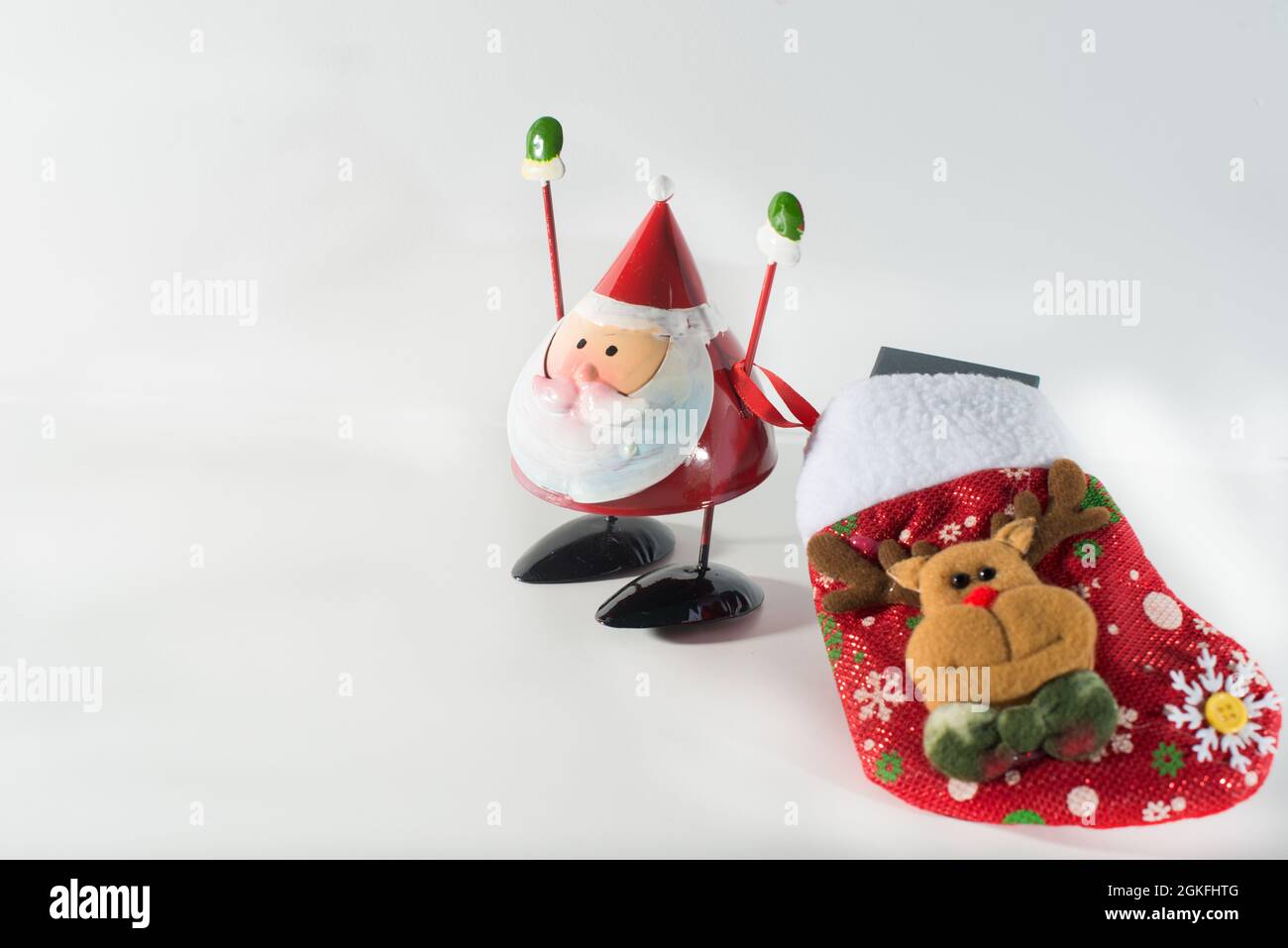 Santa with a sock full of presents with white background Stock Photo ...